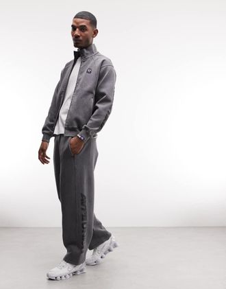 Aape By A Bathing Ape AAPE by A BATHING APE - Weit geschnittene Jogginghose in verwaschenem Schwarz, Kombiteil
