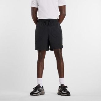 New Balance Homme Castlefield Woven Short 7 en Noir/Vert, Polytiss&eacute;, Taille 2XL