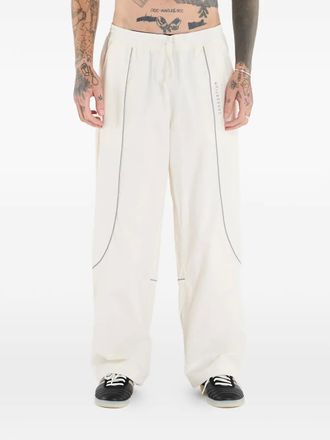 adidas x Consortium stripe-detail track pants - Tons neutres