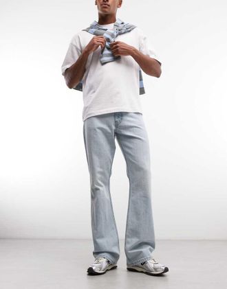 Weekday Mercury - Locker geschnittene Bootcut-Jeans in Hellblau mit ausgestelltem Bein
