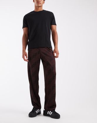 adidas Originals Firebird - Pantalon de surv&ecirc;tement &agrave; monogramme - Marron