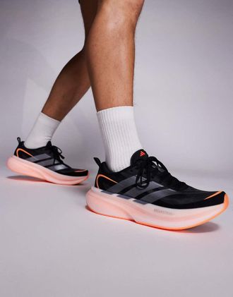 adidas adidas Running - Supernova Glide - Lauf-Sneaker in Schwarz und Orange