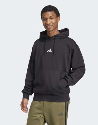 adidas Essentials Feelcozy Fleece-Hoodie in Schwarz / Wei&szlig;