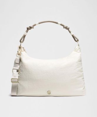lululemon Wandelbare, raffbare Crossbody-Tasche Gro&szlig; 16 L - Gr&ouml;&szlig;e 6 l in Light Ivory/Warm Ash Grey