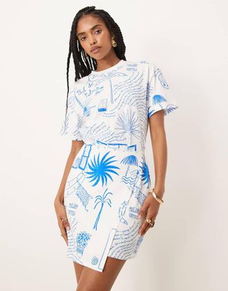 Never Fully Dressed Minikleid in Creme mit Palmenmuster und Taillenband-Weiß