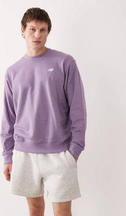 New Balance Sport Essentials - Pullover aus French-Terry in Lila mit Rundhalsausschnitt