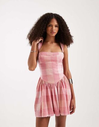 Free People Laurel - Minikleid mit tiefer Taille und Karomuster in Rosa-Bunt
