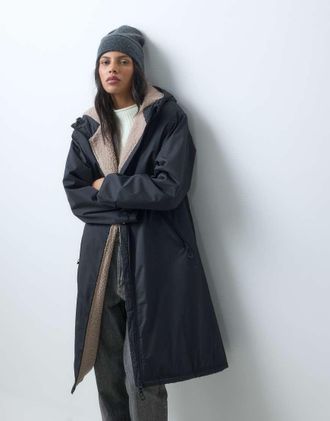 Asos trench long avec doublure en imitation peau de mouton noir