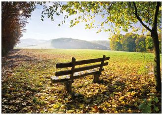 Wallario Poster - Idyllische Holzbank in den Bergen in Premiumqualität, Größe: 70 x 100 cm (Riesenposter)