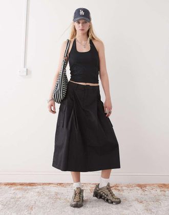 Obey Surface - Jupe plissée coupe cargo mi-longue - Noir