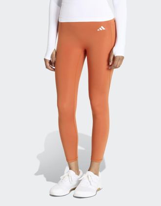 adidas adidas Performance - Optim&eacute; Essentials - Legging 7/8 sans surpiq&ucirc;res devant - Orange renard