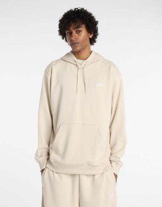 New Balance Sport Essentials - Kapuzenpullover aus French Terry in Beige-Grau