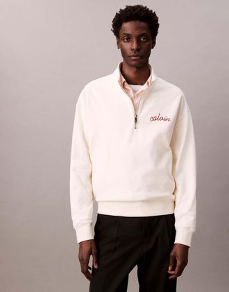 Calvin Klein Jeans Sweat-shirt avec logo brodé et col zippé - Blanc cassé