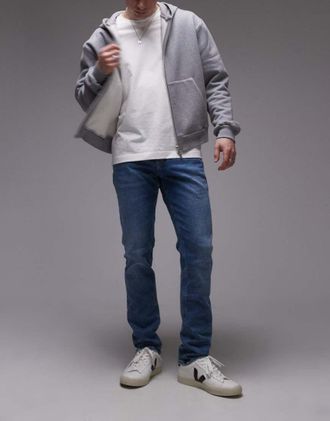 Tommy Jeans Scanton - Schmal geschnittene Jeans in mittlerer Waschung-Blau