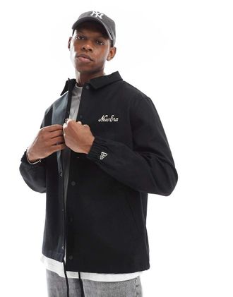New Era Veste dentraîneur avec motif au dos - Noir