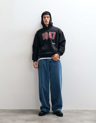 Wrangler Kapuzenpullover mit Grafikprint in Schwarz