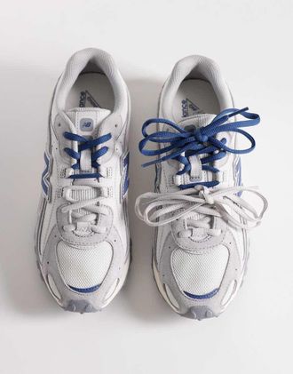 New Balance 204L - Sneaker in Grau und Marineblau