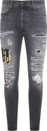 Amiri Ripped Patch Skinny Jeans