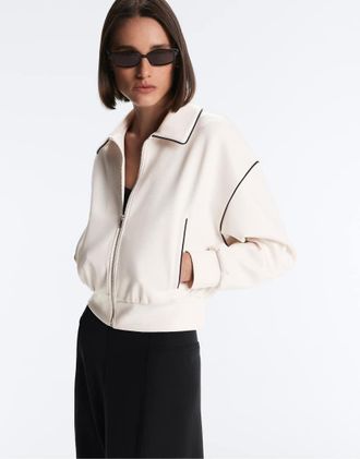 Oysho Veste effet n&eacute;opr&egrave;ne &agrave; passepoil contrastant - &Eacute;cru p&acirc;le-Transparent