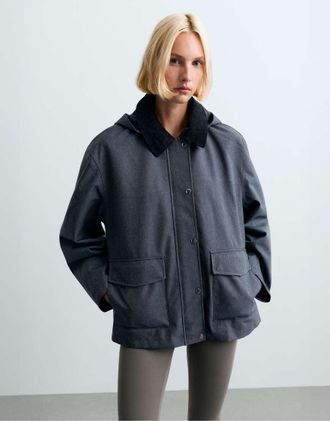 Oysho veste effet denim droite imperm&eacute;able 10k bleu marine