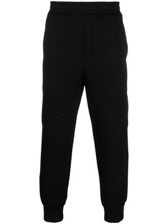 Neil Barrett pantalon de jogging &agrave; empi&egrave;cements - Noir