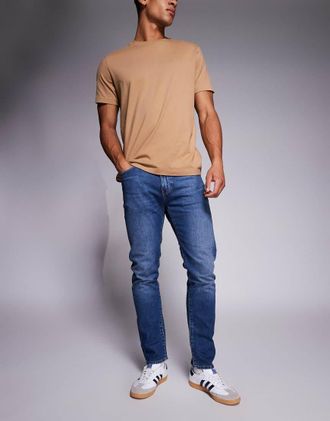 Levi's 512 - Schmal zulaufende Slim-Fit-Jeans in hellblauer Vintage-Waschung