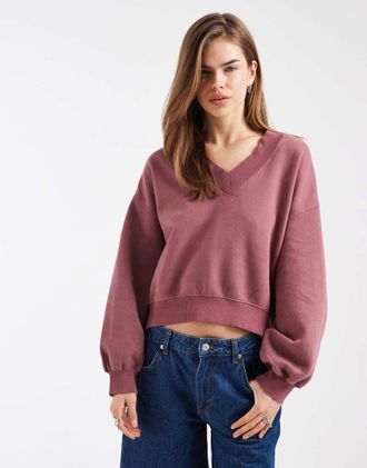 Levi's Lockeres Sweatshirt in Beerenrot mit V-Ausschnitt