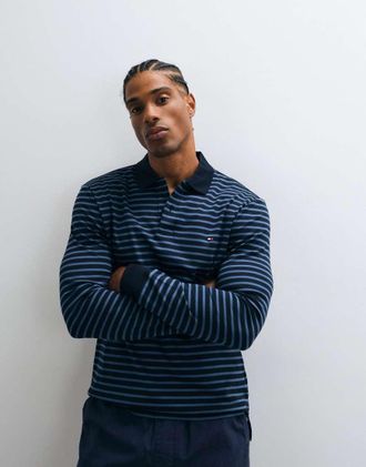 Tommy Hilfiger Poloshirt mit Flaggenlogo und langen &Auml;rmeln in Marineblau/Blau gestreift