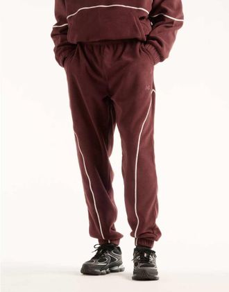 New Balance Trackside Polar-Fleece-Jogger in Kirschleder-Braun