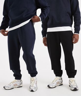 Asos 2er-Pack schmal zulaufende Basic-Jogginghosen in Schwarz und Marineblau-Bunt