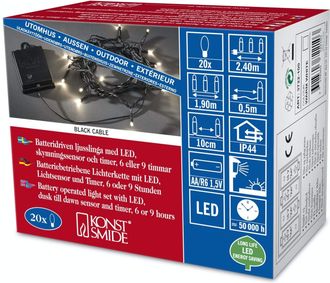 Konstsmide 3722-100 LED Lichterkette / für Außen (IP44) / Batteriebetrieben: 4xAA 1.5V (exkl.) / mit Lichtsensor, 6h und 9h Timer / 20 Dioden / schwarzes Kabel, 