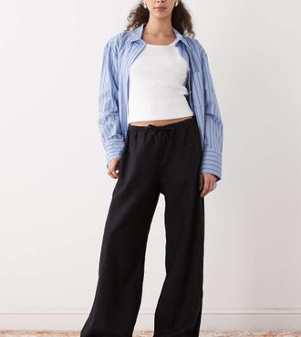 Weekday Exclusivit&eacute; ASOS - Weekday - Pantalon ample &agrave; enfiler en lin m&eacute;lang&eacute; - Noir