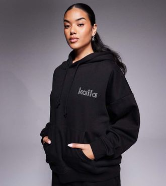 KAIIA Exclusive - Oversize-Kapuzenpullover mit hohem Baumwollanteil in Schwarz mit Strass-Logo, Kombiteil