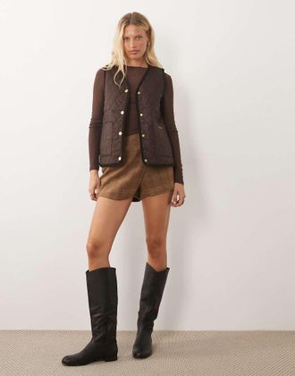 Barbour Icons reimagined wendbare gesteppte Linger-Weste mit Karomuster in Braun-Schwarz