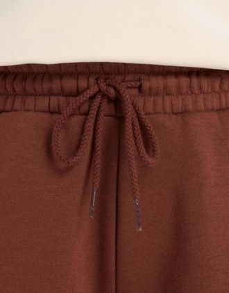 New Balance Linear Heritage - Fleece-Hose in Braun mit weitem Bein-Brown
