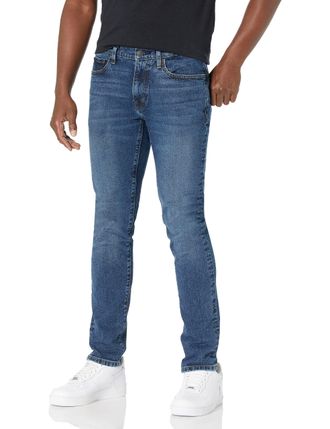 Amazon Essentials Herren Stretchjeans, Skinny-Passform - Auslauffarben, Vintage Waschung, 32W / 28L