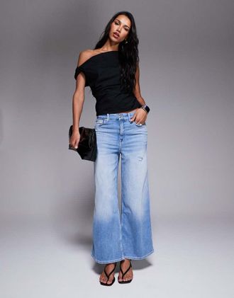 Good American Good Skate - Weite Cropped-Jeans in Mittelblau-Marineblau