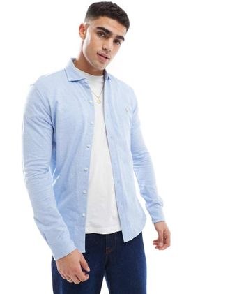 Polo Ralph Lauren Chemise en jersey &agrave; col en pointe avec logo embl&eacute;matique et imprim&eacute; &agrave; chevrons - Bleu clair chin&eacute;