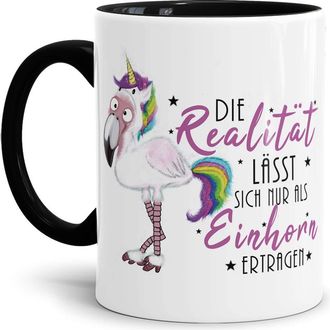 Tassendruck Flamingo-Tasse im Einhorn-Kost&uuml;m mit Spruch: Die Realit&auml;t l&auml;sst Sich nur als Einhorn ertragen/Mug/Cup/Unicorn/Innen & Henkel Schwarz
