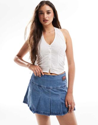 Superdry Mini-jupe pliss&eacute;e &agrave; &eacute;cusson - D&eacute;lavage vintage-Bleu